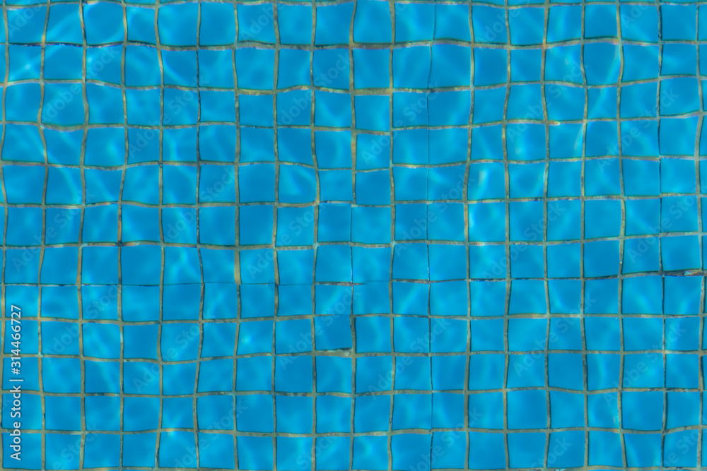 Beautiful texture of water with sun lights in a pool on the blue ...