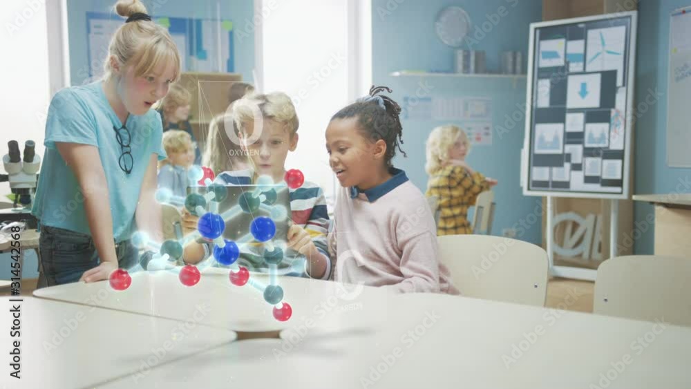 Three Diverse School Children in Chemistry Science Class Use Digital ...