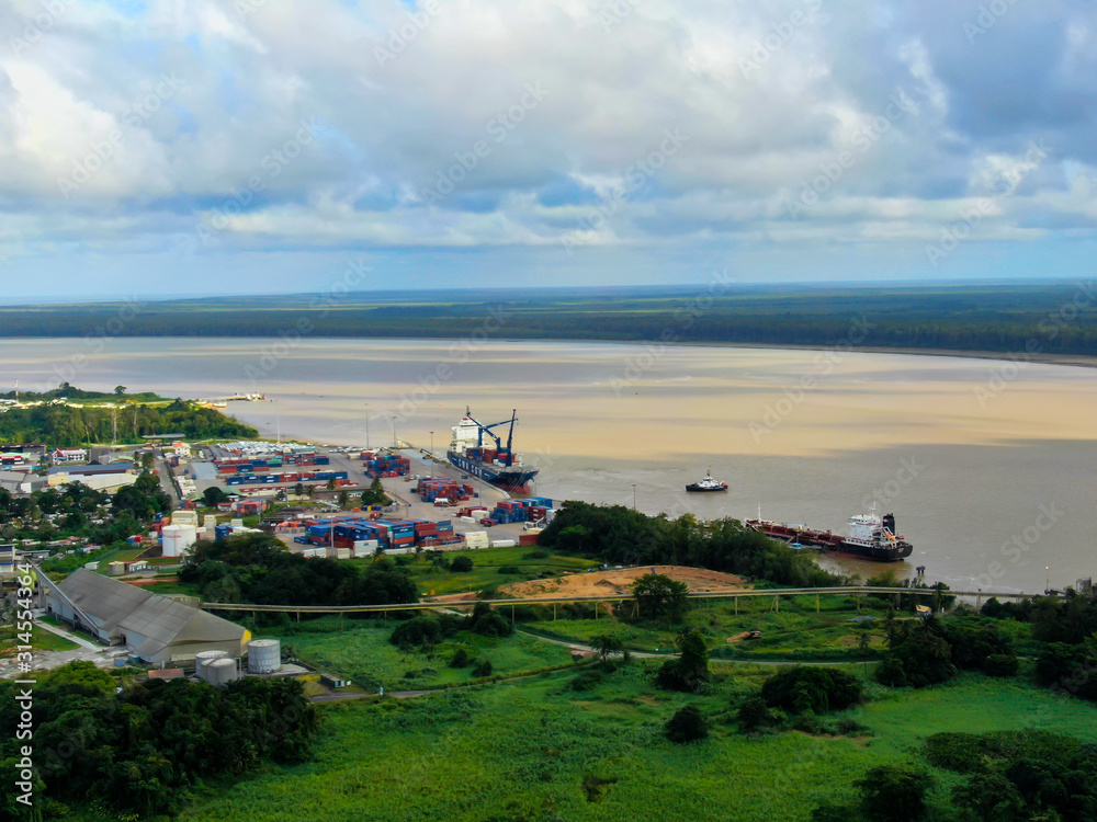 French Container ship alongside at port, discharging containers by ...
