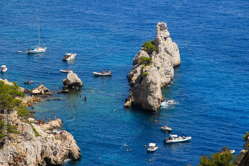 Rock in the shape of a torpedo boat in the Mediterranean Sea in the ...