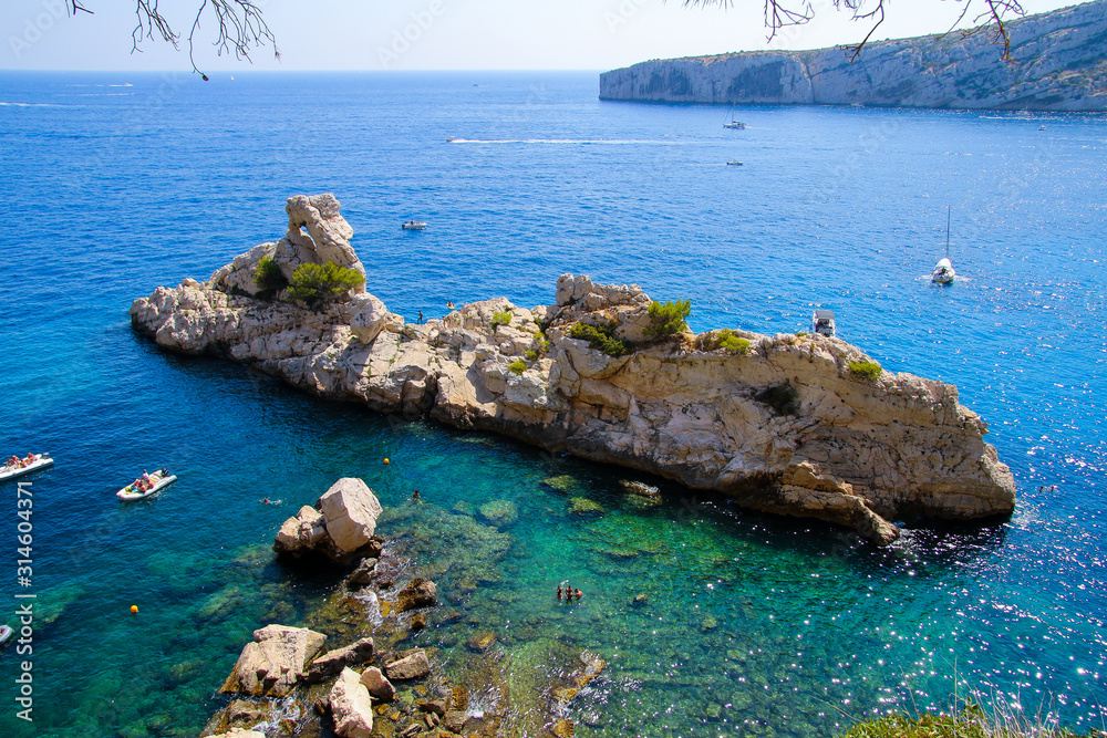 Rock in the shape of a torpedo boat in the Mediterranean Sea in the ...
