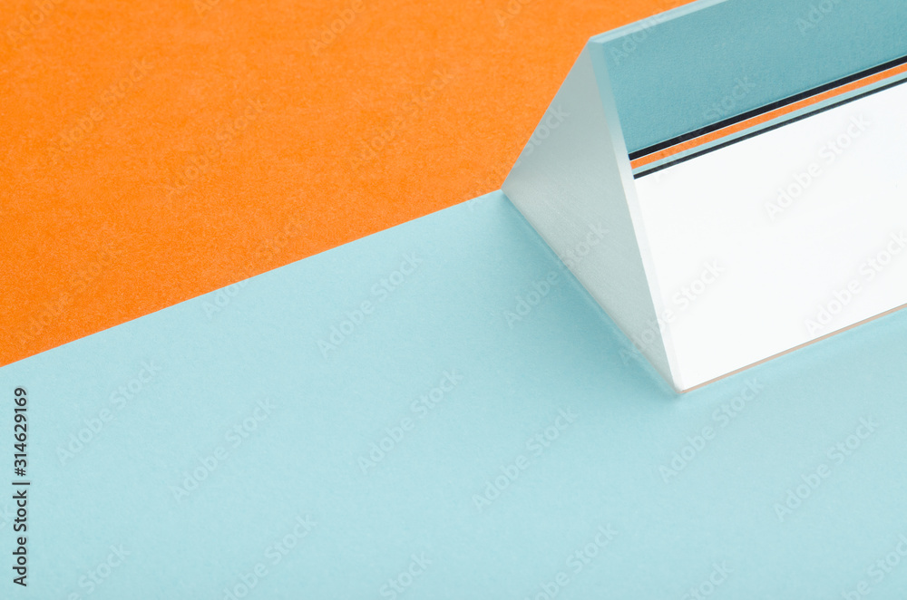 triangular prism on orange-blue background, minimalism, abstraction ...