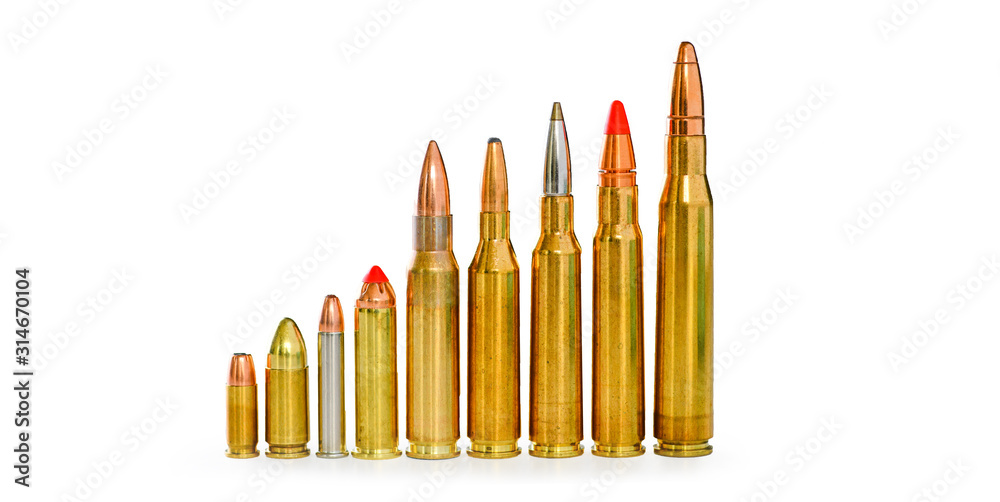 Various bullets ammunition on stone table wide banner or panorama ...