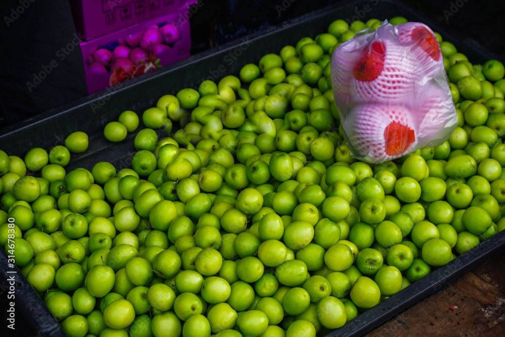 Tropical fruit Ziziphus mauritiana selling in market. Well known as ...
