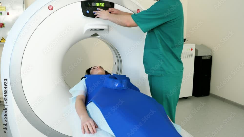 Professional radiologist controls CT or MRI or PET scan with female ...