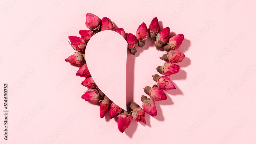 Minimalistic concept of Valentine's day, half heart pink paper, dry ...