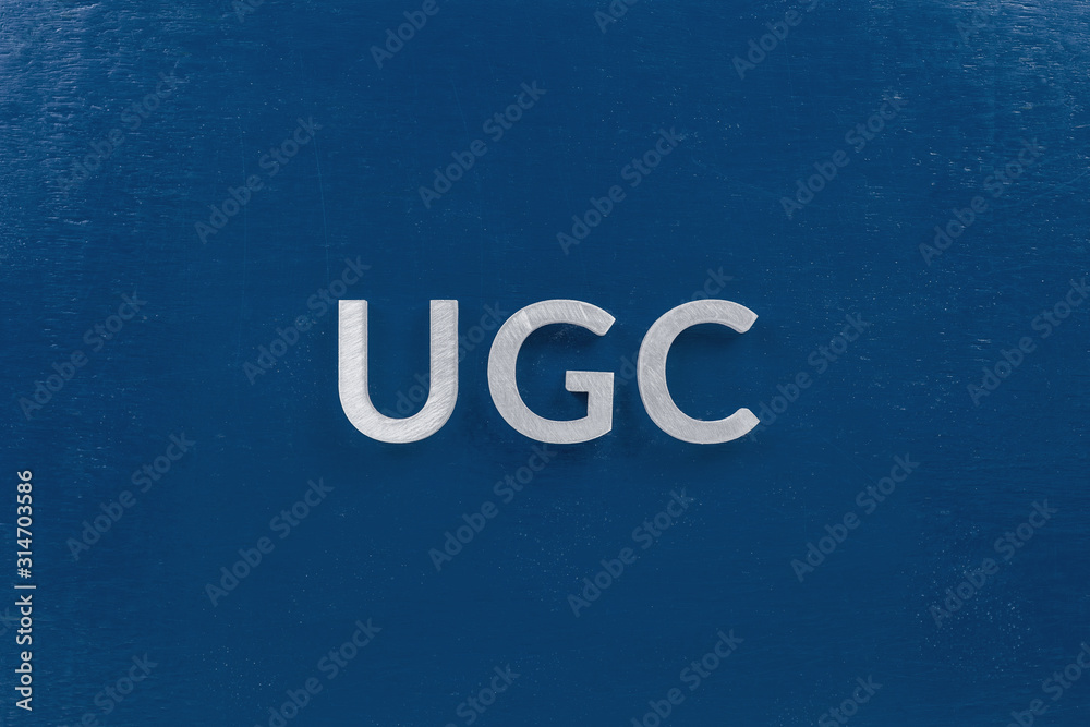 the word ugc - user generated content - laid by white silver metal ...