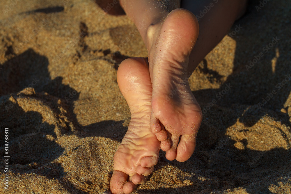 young girl's toes are healthy and beautiful. Well-groomed toes. Concept ...