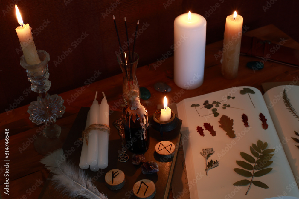 magic ritual of the alchemist with candles, runes and symbols Stock ...