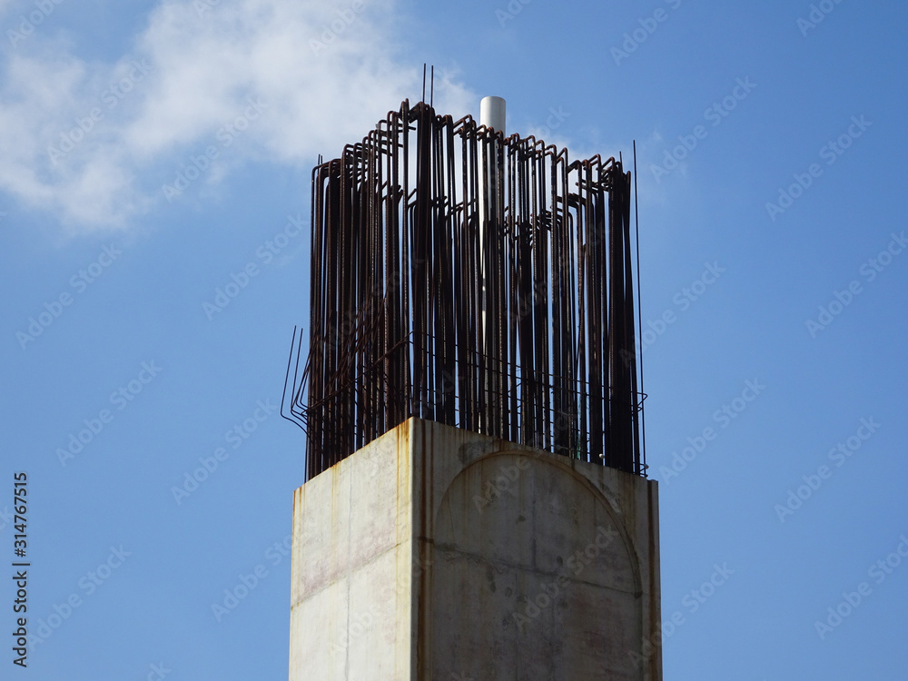 Steel reinforced concrete column under construction. It is as part of ...