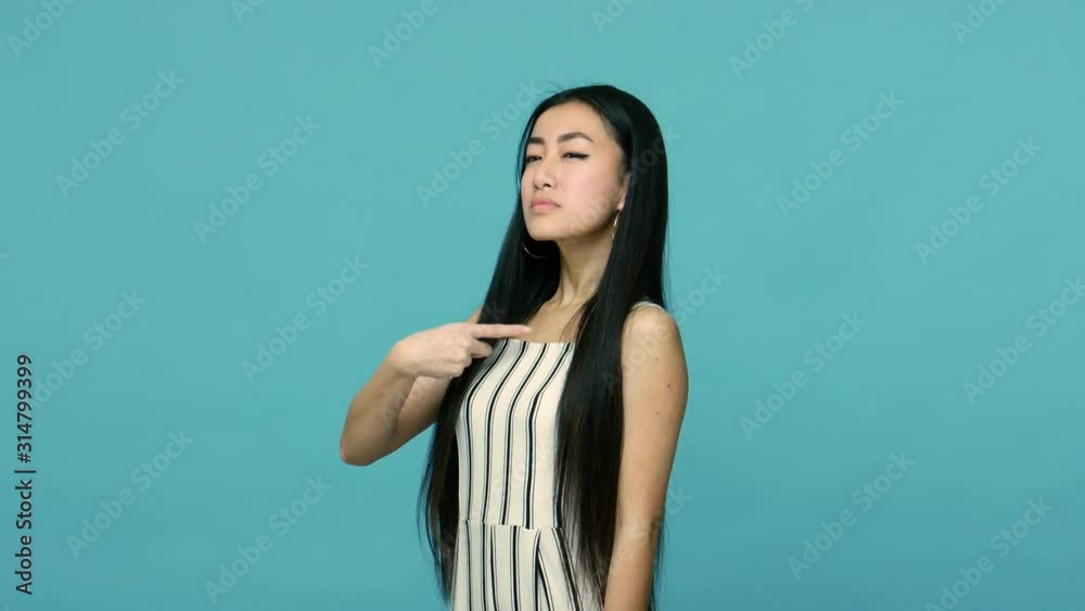 Stunning arrogant asian woman with long straight black hair pointing ...