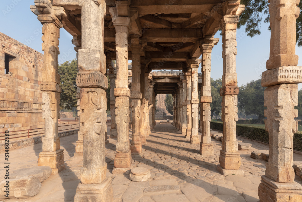 Ruins of Qutub Minar complex, a UNESCO world heritage site in New Delhi ...
