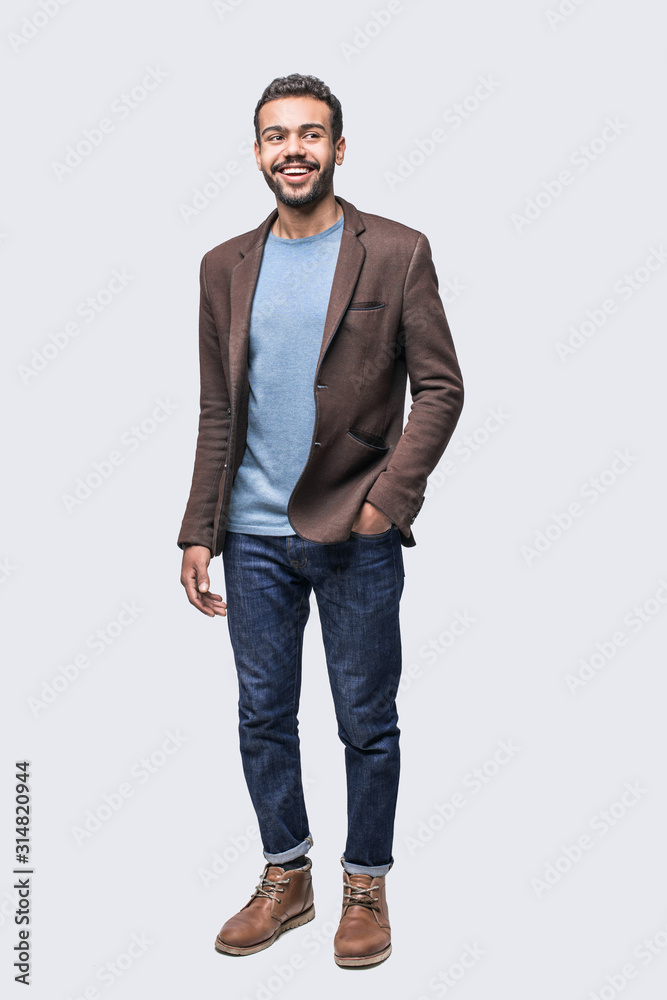 Full length studio portrait of handsome smiling young man isolated on ...