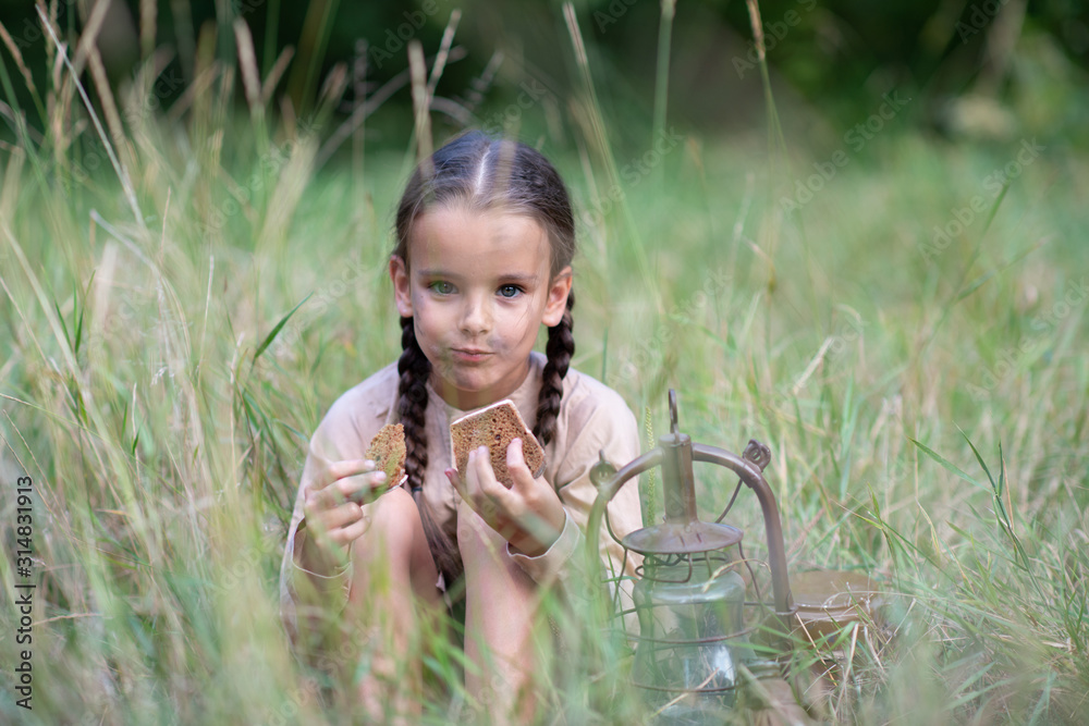 Pretty little girl with long pigtails and beautiful dirty face at ...