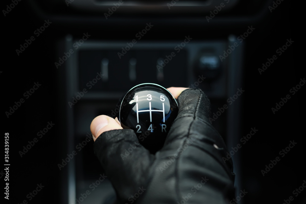 Gear lever. Manual Transmission. Hand on the gear shift in a car. Stock ...