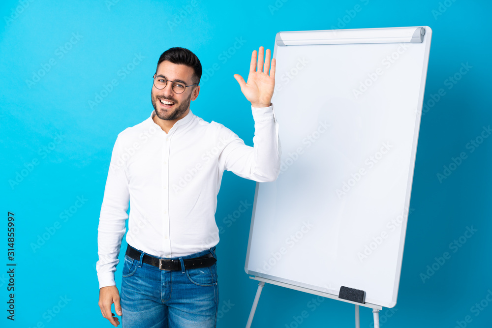 Businessman giving a presentation on white board giving a presentation ...