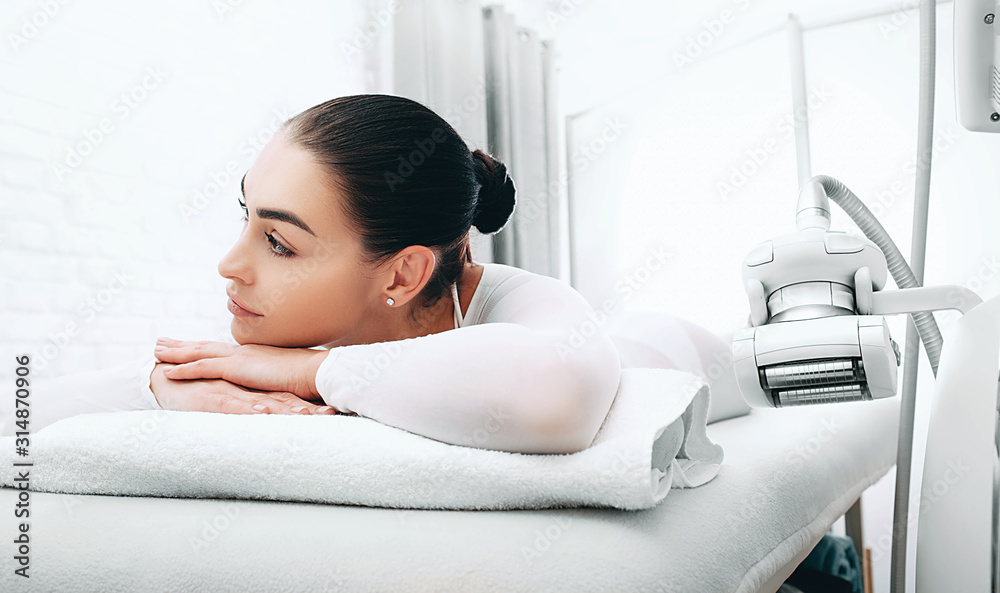 Beautiful Woman After Lpg Massage Relaxes On Massage Table Near Lpg