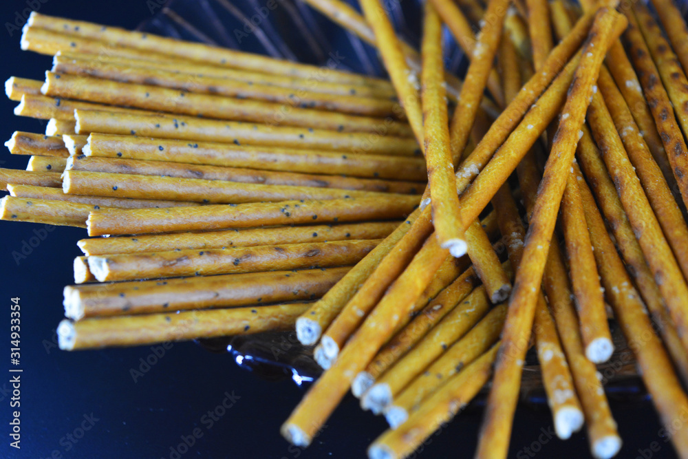 Sweet and salted straws with poppy seeds and salt made from flour ...