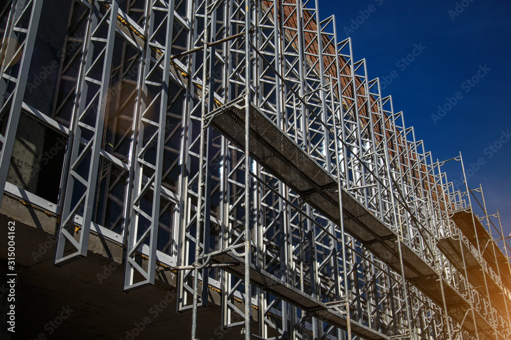 Extensive scaffolding providing platforms for work in progress on a new ...