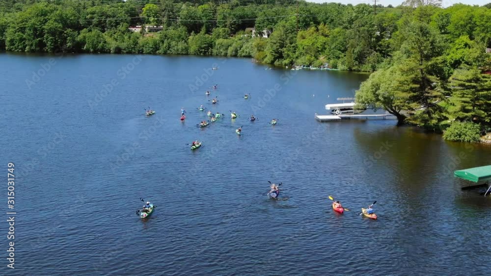 Group Kayaking in Traverse City Northern Michigan with blue sky clear ...