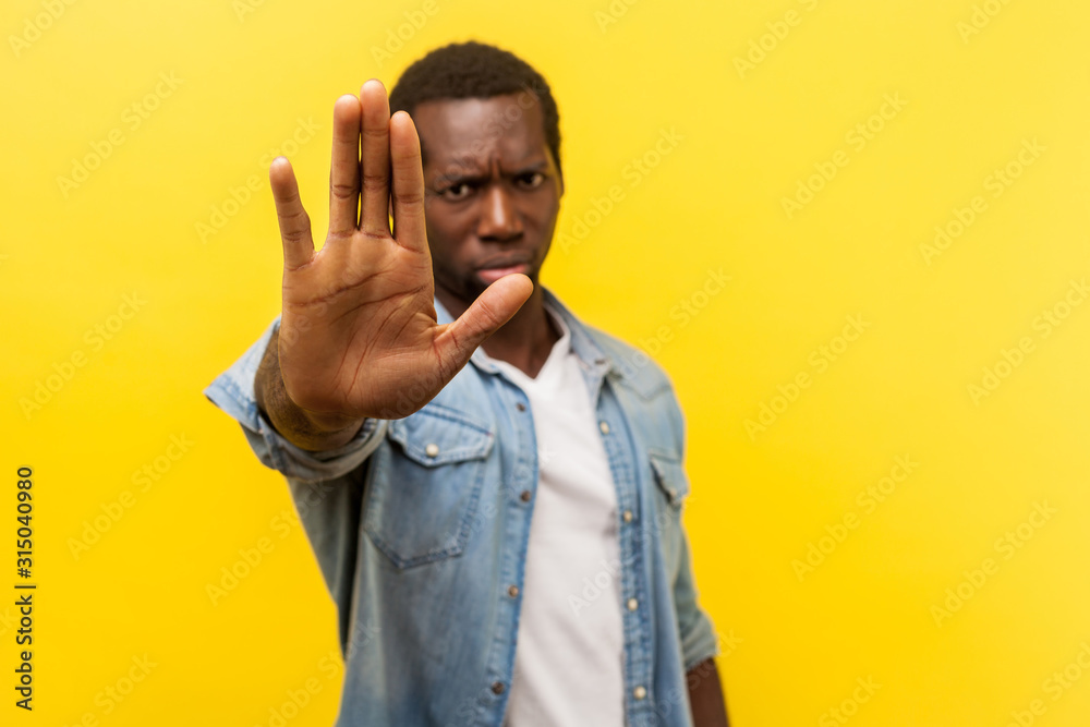 Prohibition. Portrait of serious angry man in denim casual shirt ...