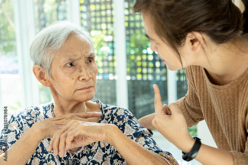Asian senior woman is confused because she can not remember the face of ...