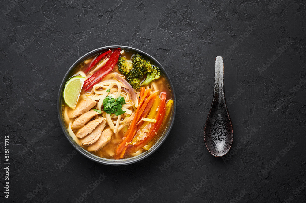 Chicken Thukpa in black bowl at dark slate background. Chicken Thukpa ...
