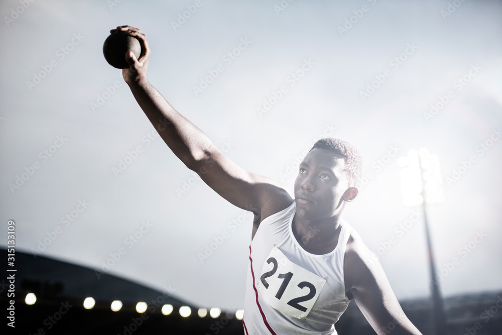 Track and field athlete throwing shot put Stock Photo | Adobe Stock