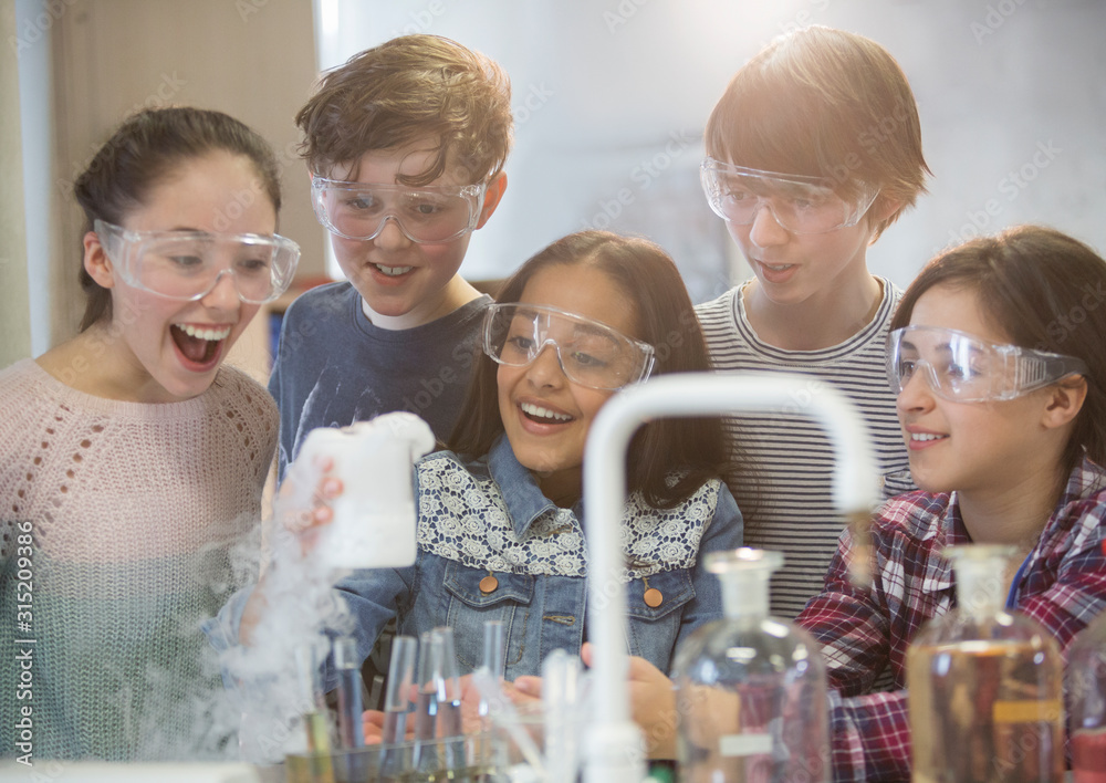Surprised students conducting scientific experiment, watching chemical ...