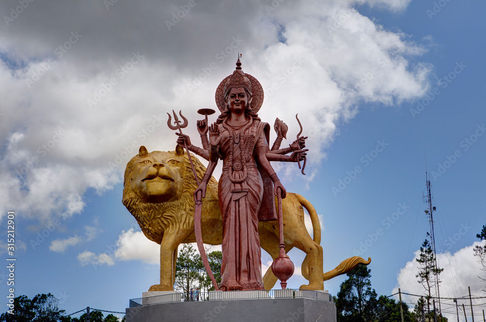The giant statue of Durga at the Hindu temple Ganga Talao, Grand Bassin ...