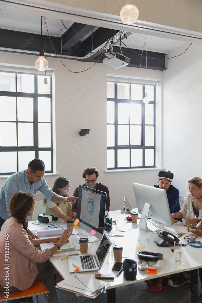 Computer Programmers Programming Virtual Reality Simulator Glasses In Open Plan Office Stock