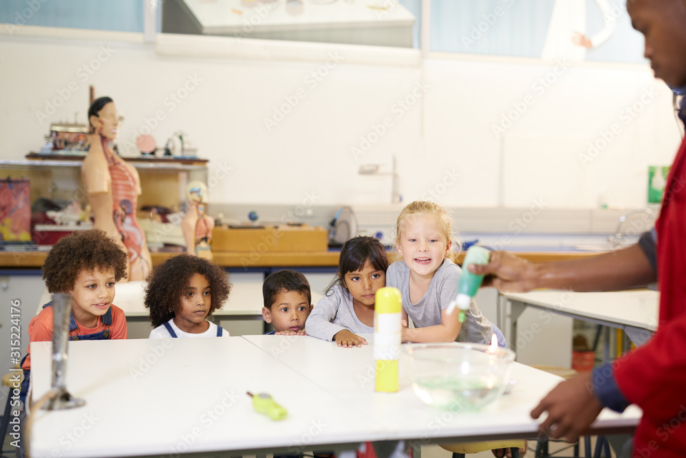 Curious kids watching science experiment in science center Stock Photo ...