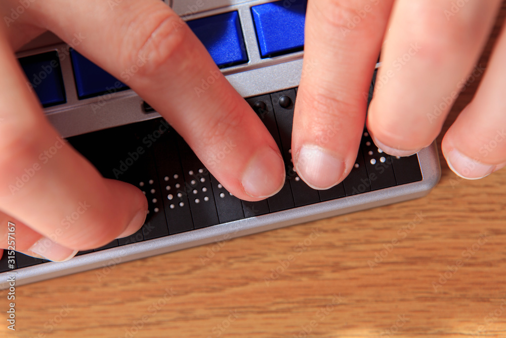 Visually impaired using Braille display Stock Photo | Adobe Stock
