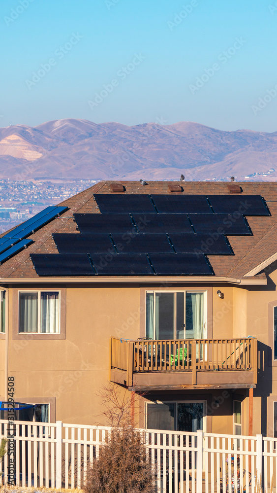 Vertical House with rooftop solar panels in Utah Valley Stock Photo ...