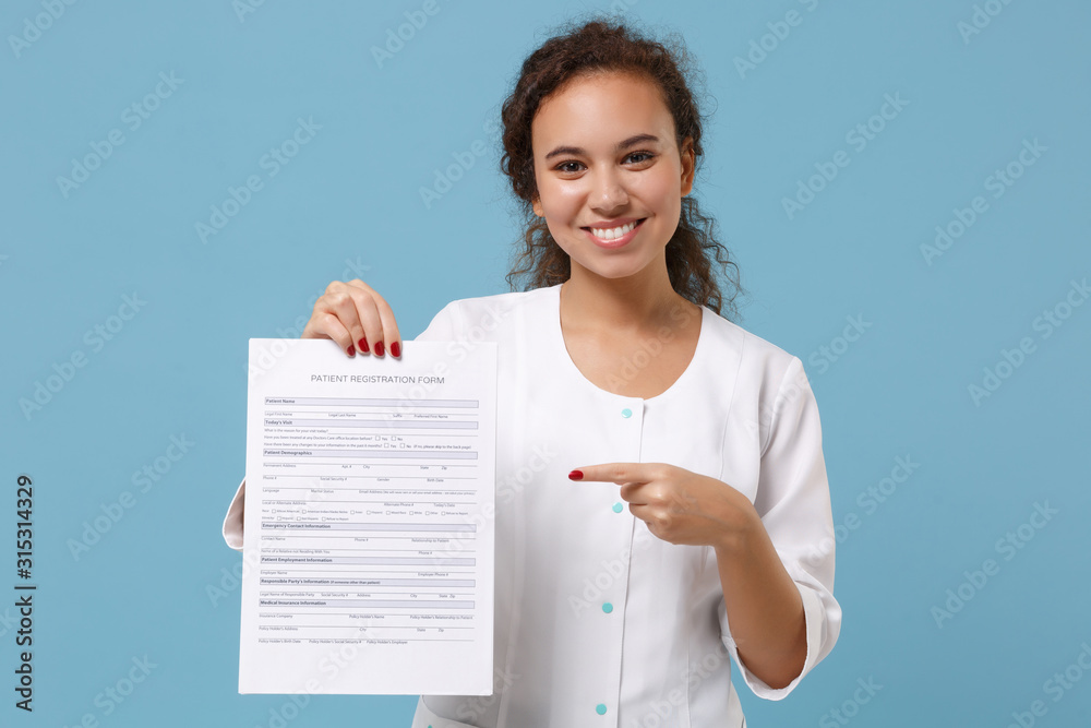 Pretty african american female doctor woman in medical gown pointing ...
