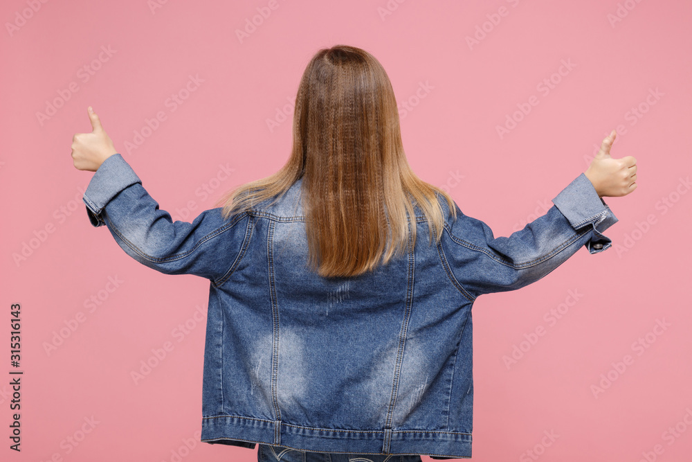 Back rear view of little blonde kid girl 12-13 years old in denim ...