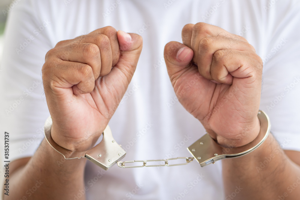 arrested man criminal gets locked up by handcuff; crime scene ...