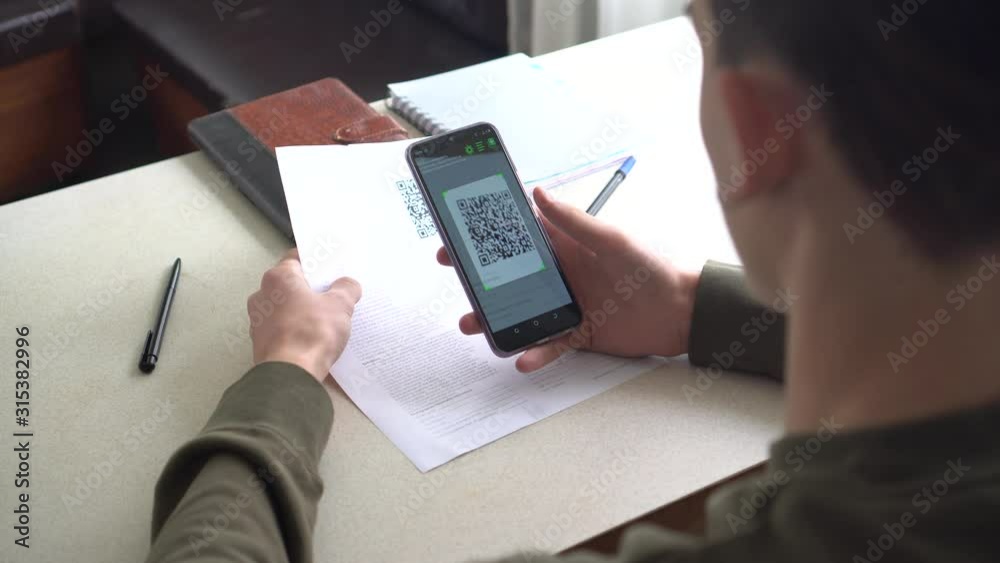 User scans the image of the QR code to display text, contact ...