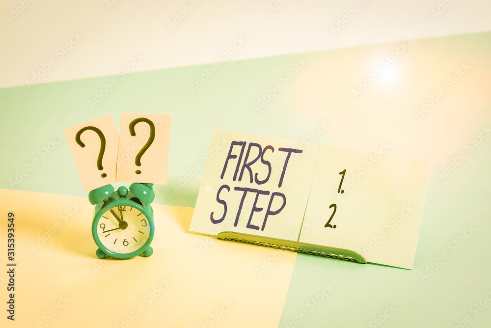 Writing note showing First Step. Business concept for The first of a ...