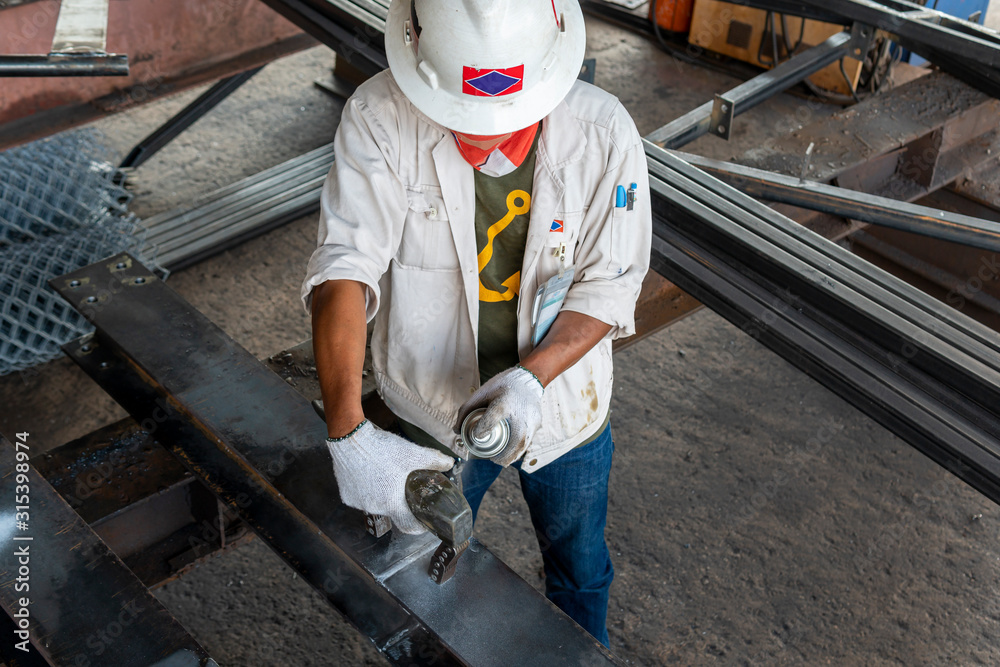 The inspectors are checking defect in welded of steel add joint with ...
