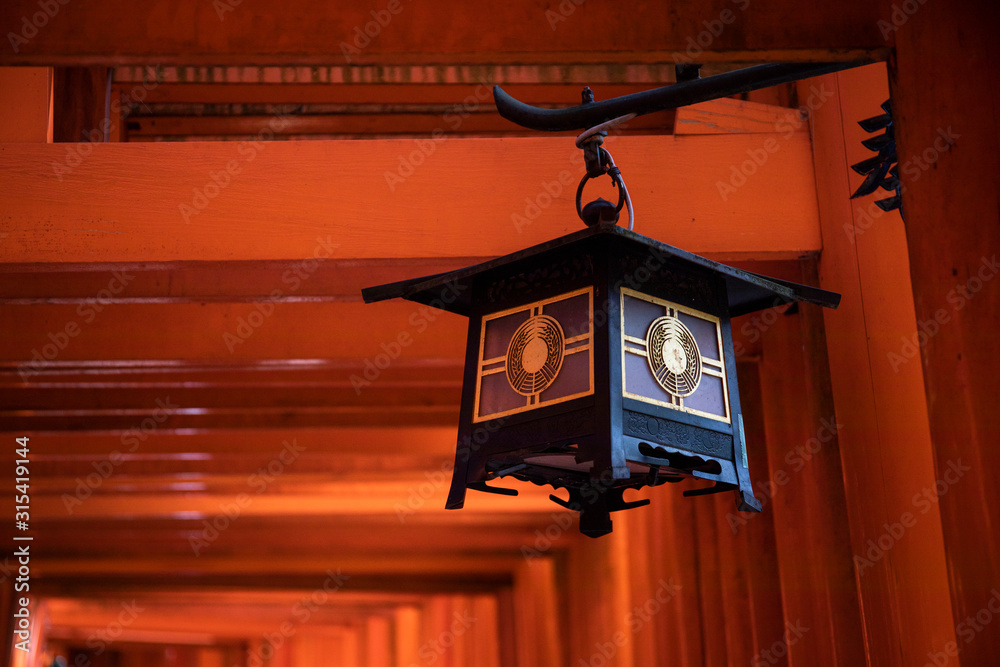 Japan, Kyoto Prefecture, Kyoto City, Lantern hanging under torii gate ...