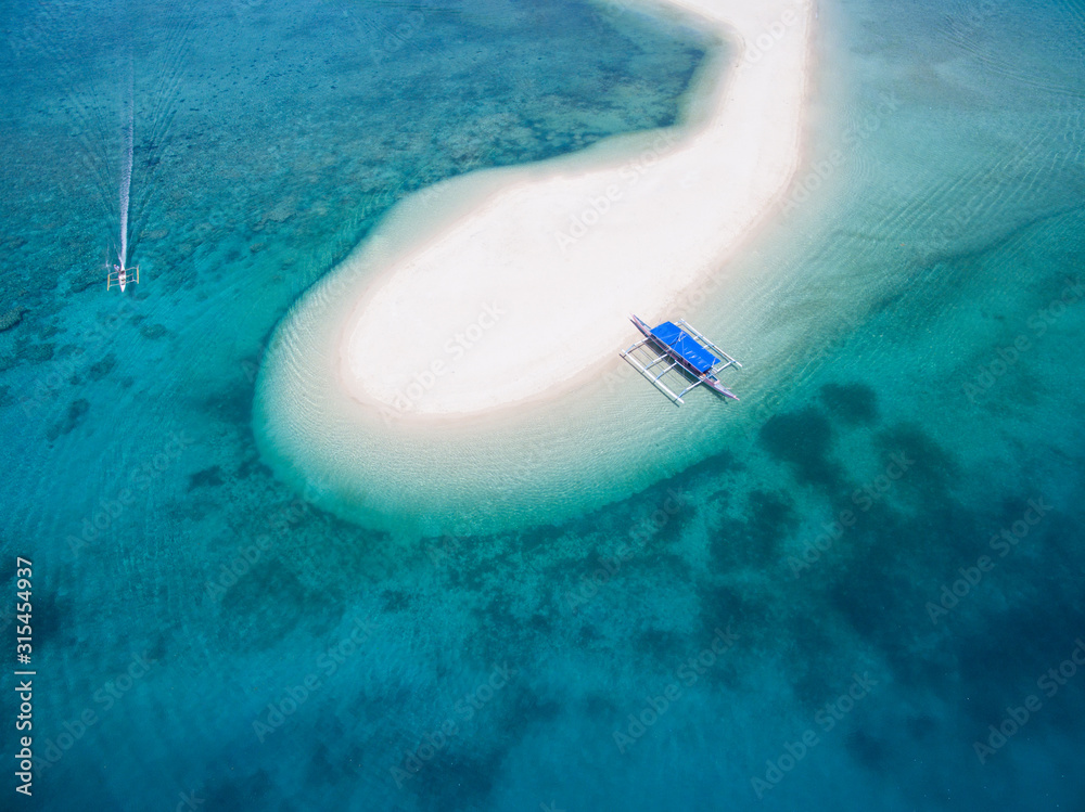 Tiny traditional southeast Asian oriental man made bamboo pontoon ...