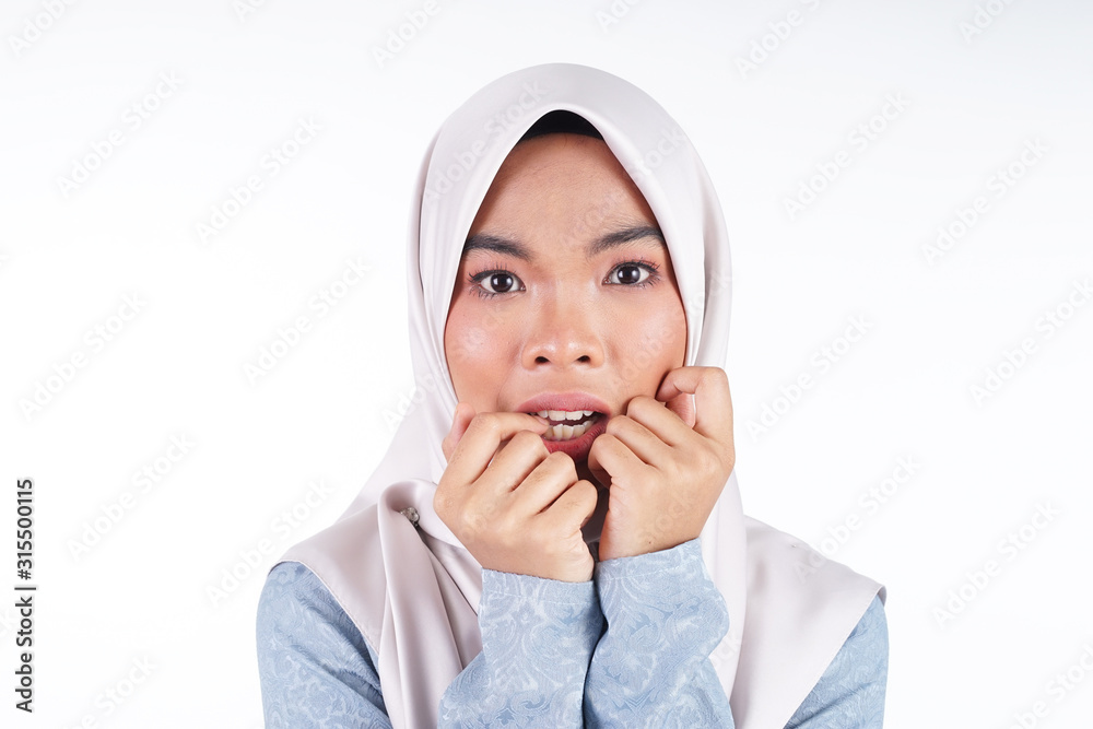 Headshot of a cute Muslim teenager wearing hijab showing various facial ...