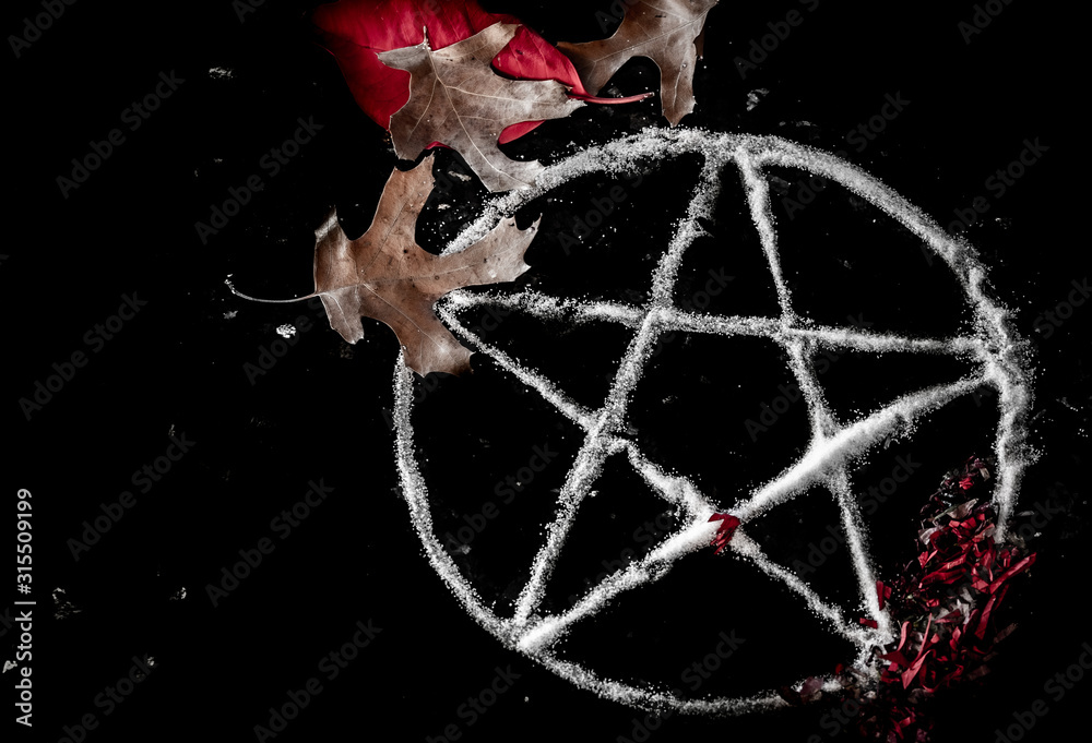 Pentagram made of salt, a symbol used for protection, surrounded by ...