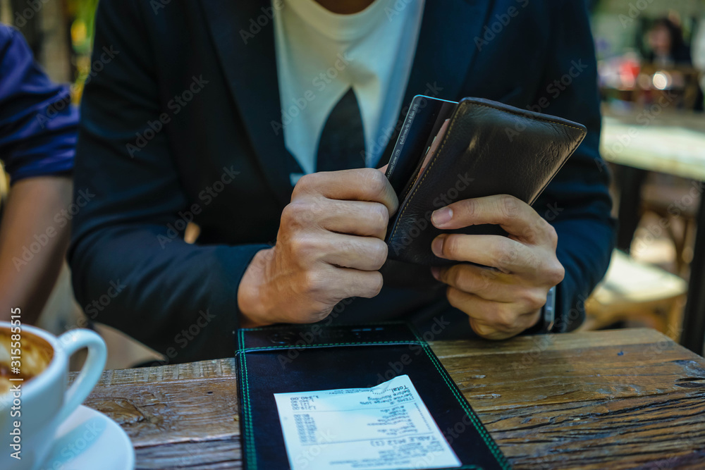 Credit card payment. Pay bill. A man is paying a bill by grabbing ...