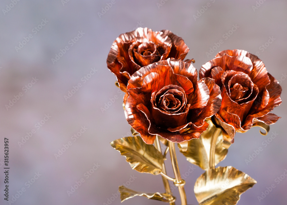 copper red roses made of metal as symbol of immortal love Stock Photo ...