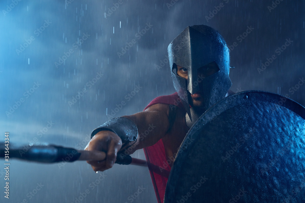 Muscular spartan fighting with spear. Stock Photo | Adobe Stock