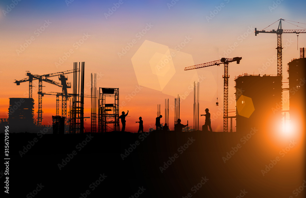 Silhouette of Survey Engineer and construction team working at site ...