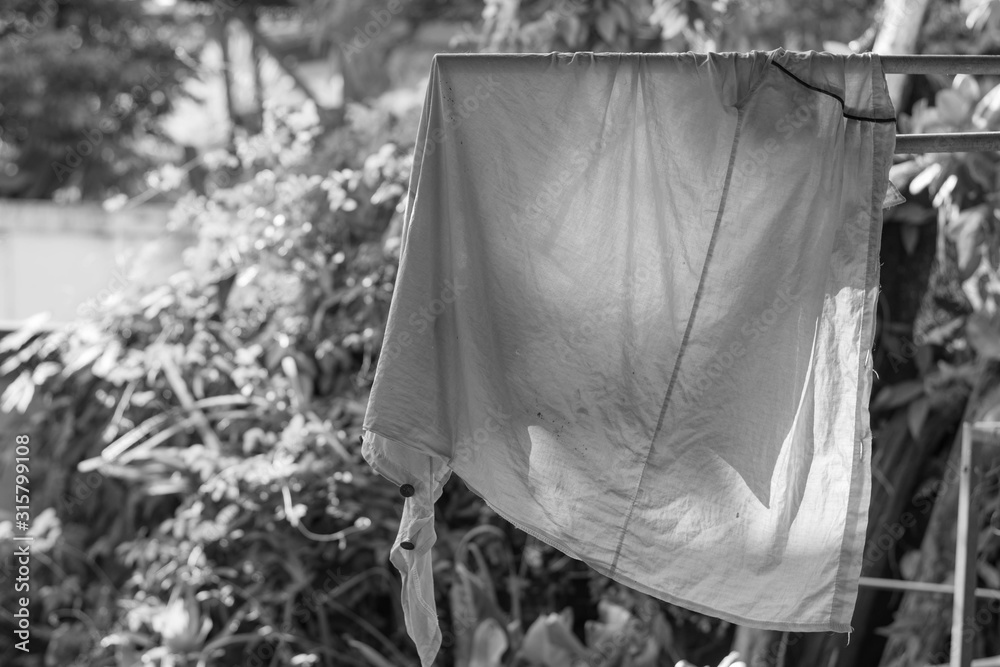 Black and white pictures, old clothes torn on iron railings Stock Photo ...