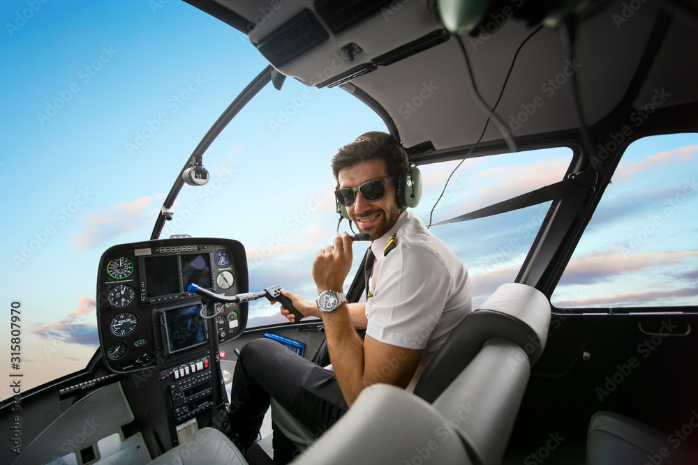 Man Pilot flying a helicopter, Shot of a pilot inside cockpit flying ...